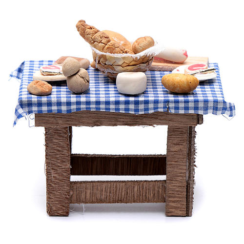 Neapolitan nativity scene table with food and chequed tablecloth ...